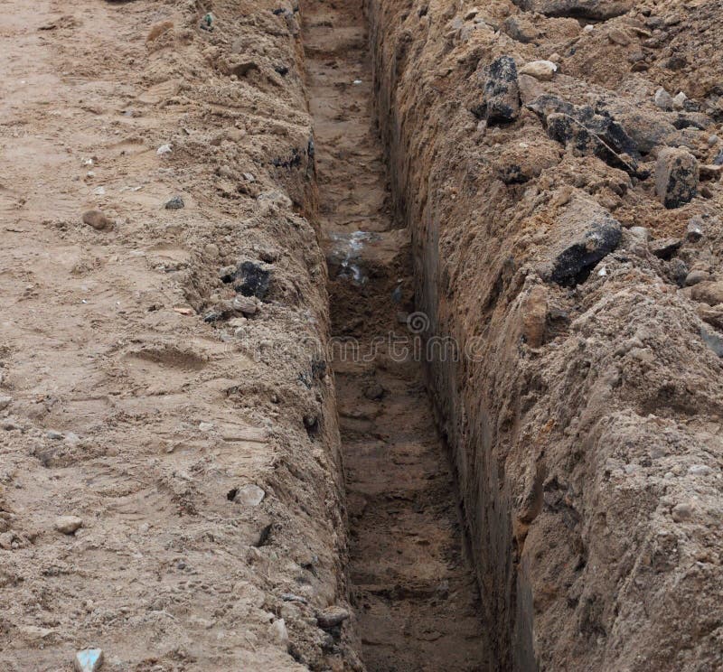 Trench in the ground stock photo. Image of communication - 27198178