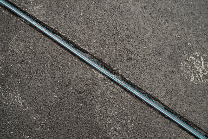 A Trench on the Pavement in Asphalt with a Cable, Top View Stock Image ...
