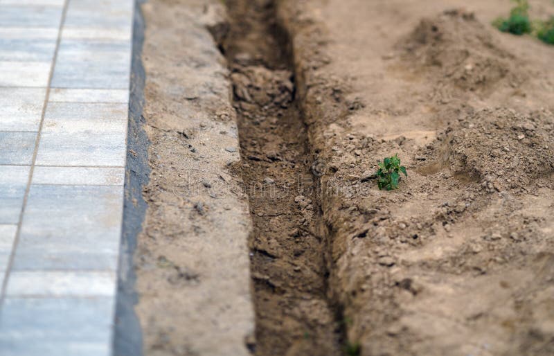 Trench and tiled path stock photo. Image of outdoor - 322562478
