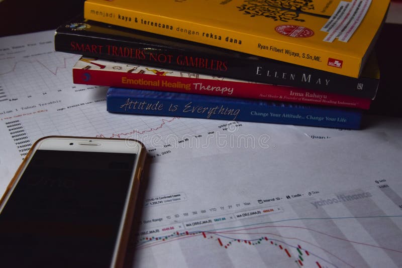 Trend Chart of Stock Market and Books on Desk Editorial Stock Image ...
