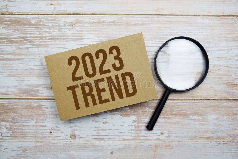 Trend 2023 Text Message and Magnifying Glass with Space Copy on Wooden ...