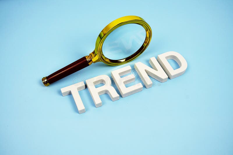 Trend Word with Magnifying Glass Top View on Blue Background Stock ...