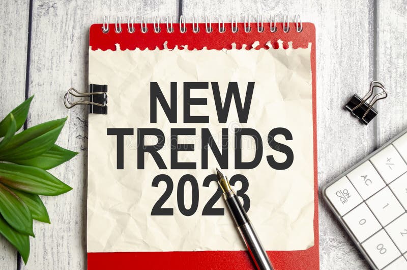 TRENDS 2023 Text on Paper with Red Notebook and Pen with Calculator ...
