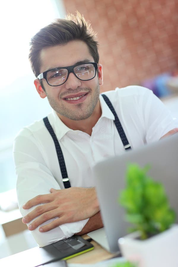 Trendy guy at work stock image. Image of communication - 46944719