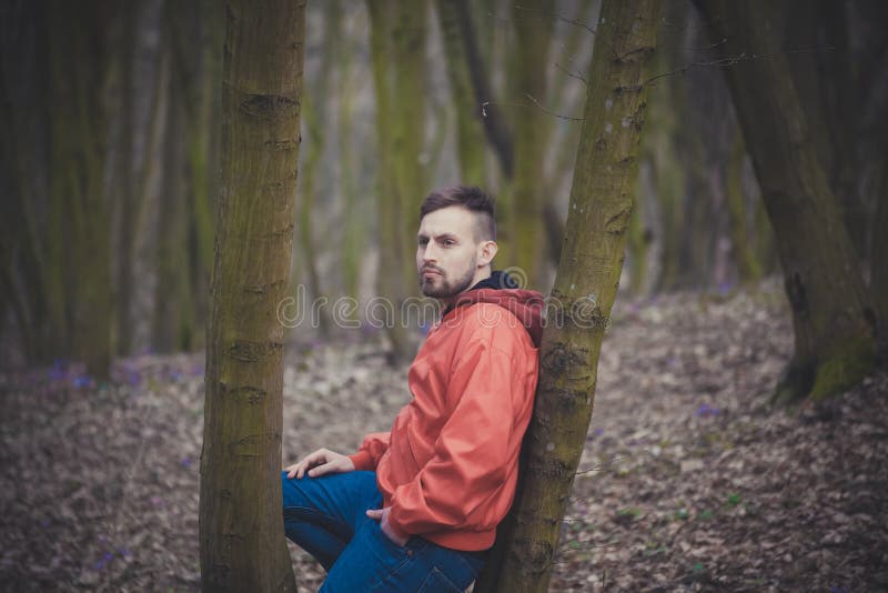 Trendy Handsome Man Posing in Spring Park Alone Stock Image - Image of ...
