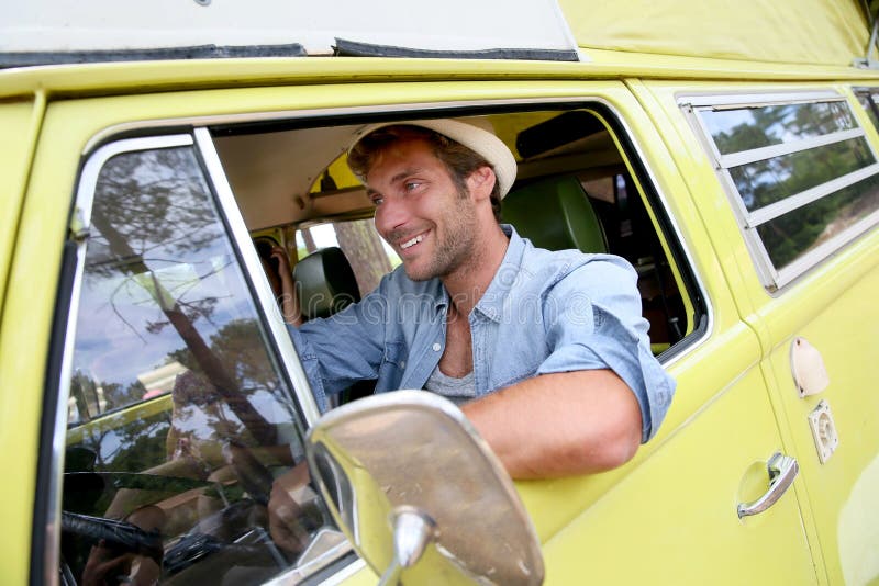 Trendy Man Driving a Camper Van Stock Photo - Image of vintage, smile ...