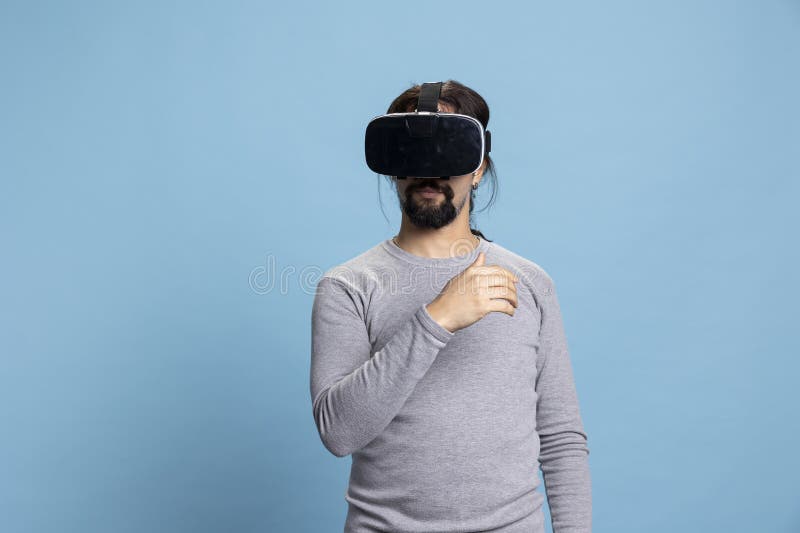Trendy Middle Eastern Guy Using Virtual Reality Headset on Camera Stock ...