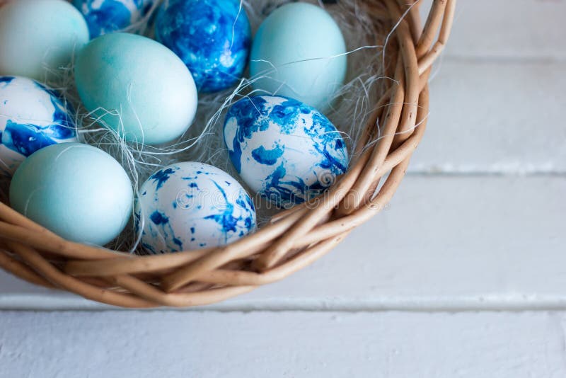 Trendy Painted Blue Easter Eggs in a Basket Stock Photo - Image of ...