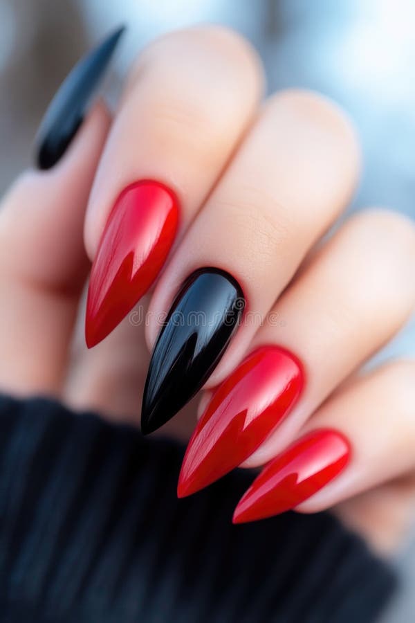 Trendy Red and Black Stiletto Nails with Glossy Finish Stock Image ...