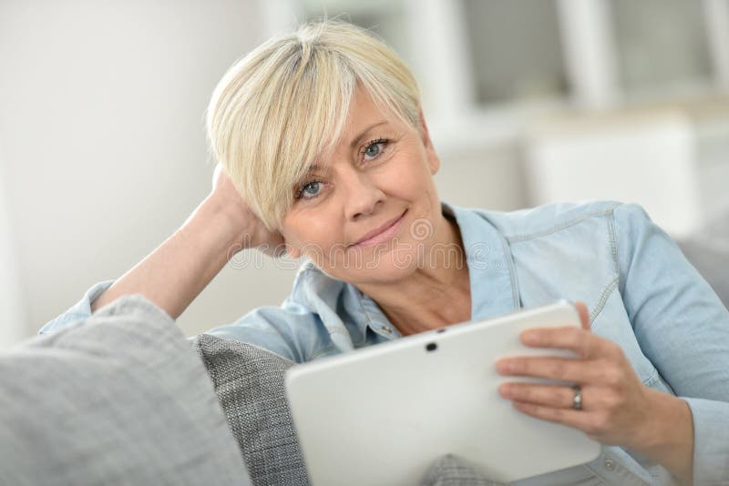 Trendy Senior Woman Using Tablet at Home Stock Photo - Image of smile ...