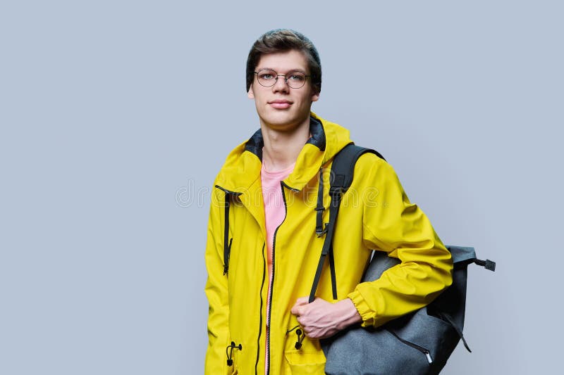 Trendy Young Male in Yellow Jacket Hat Backpack on Grey Background ...