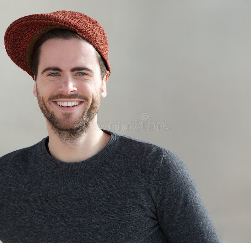 Trendy Young Man Smiling with Hat Stock Photo - Image of outdoors ...