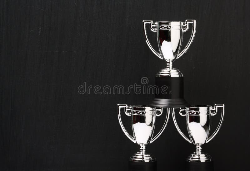 Tres trofeos de plata foto de archivo. Imagen de ganadores - 40887476