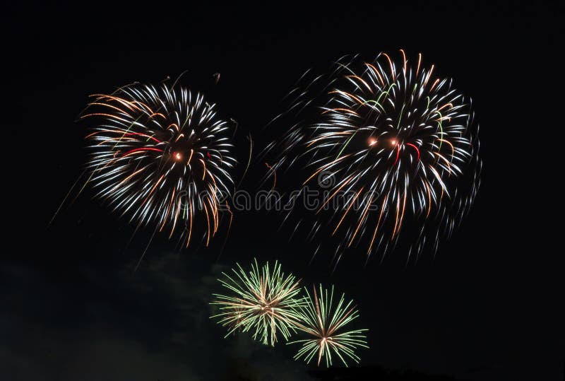 A Triad of Fireworks that Envelope the Evening Sky Stock Photo - Image ...