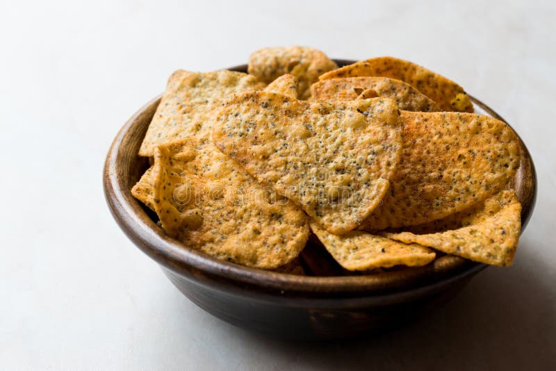 Triangle Corn Chips with Poppy Seeds Stock Photo - Image of bowl, chip ...
