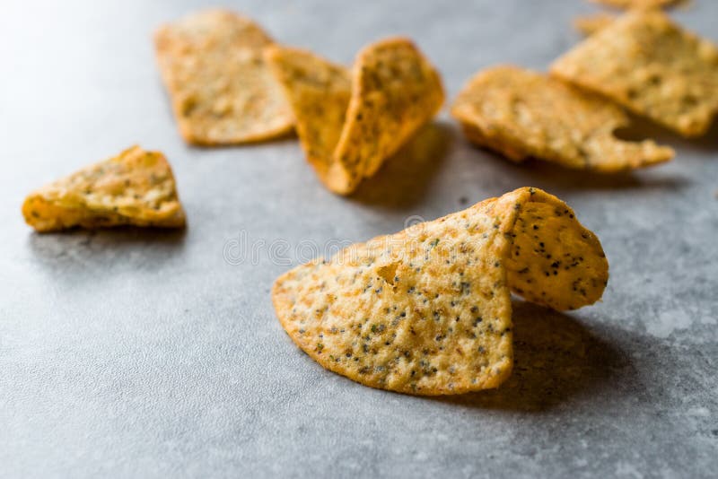 Triangle Corn Chips with Poppy Seeds Stock Image - Image of pack, heap ...