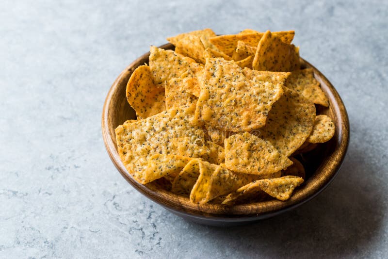 Triangle Corn Chips with Poppy Seeds Stock Image - Image of heap ...