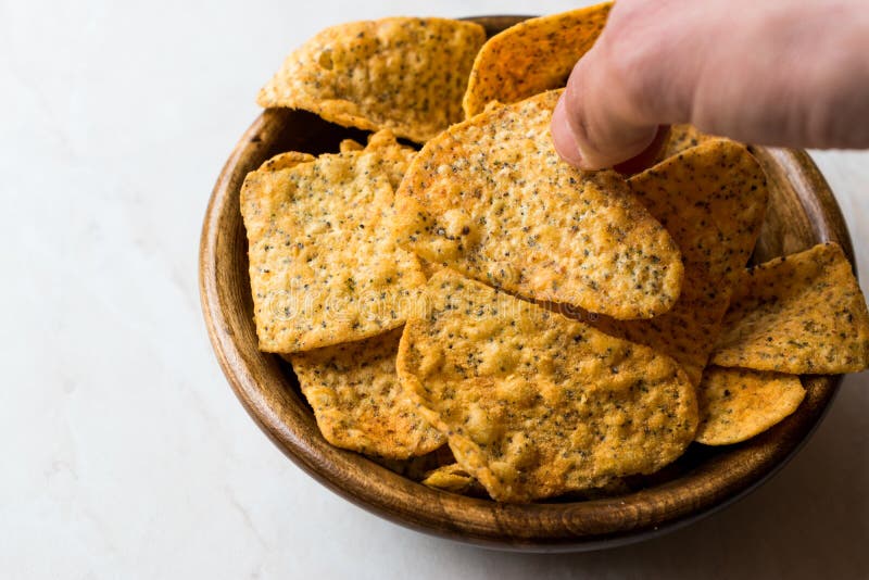 Triangle Corn Chips with Poppy Seeds Stock Photo - Image of crisp ...