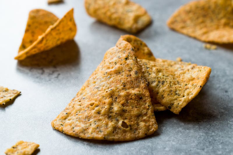 Triangle Corn Chips with Poppy Seeds Stock Photo - Image of crisp ...
