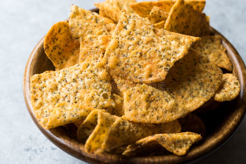 Triangle Corn Chips with Poppy Seeds Stock Photo - Image of crisp ...