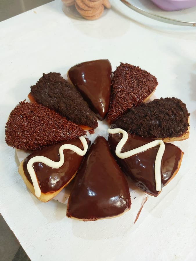 Triangle Donuts with Chocolate Topping Stock Photo - Image of triangle ...