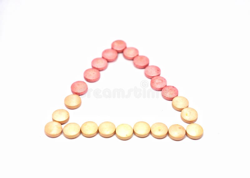 Triangle Made with Orange and Pink Pills Isolated on White Background ...