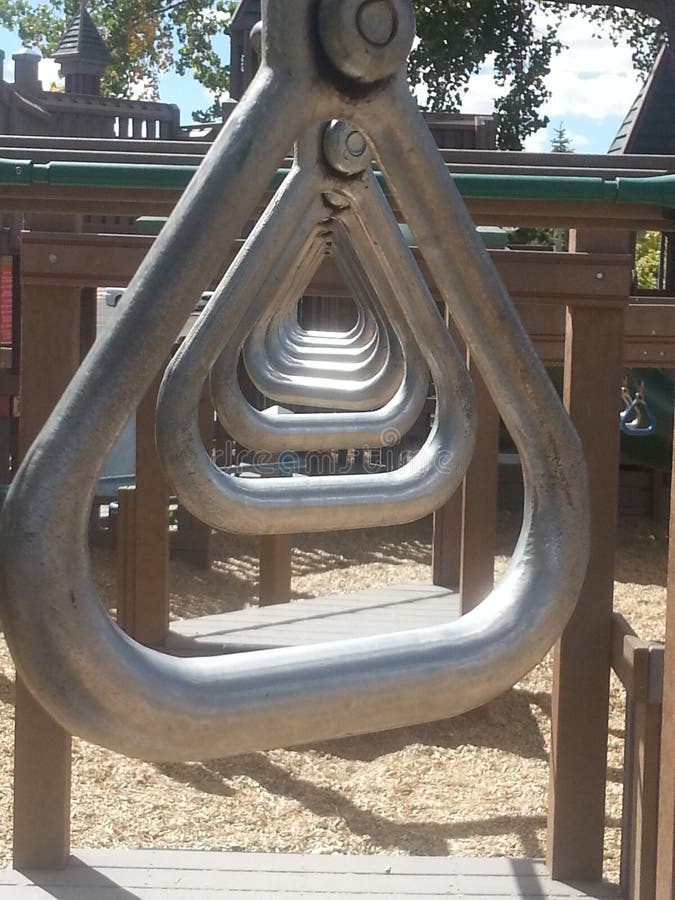 Triangle Monkey Bars stock image. Image of outdoors, metal - 64835685