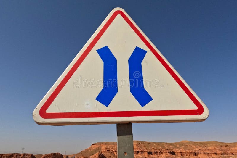 Triangle Narrow Road Sign stock photo. Image of upcoming - 339288922