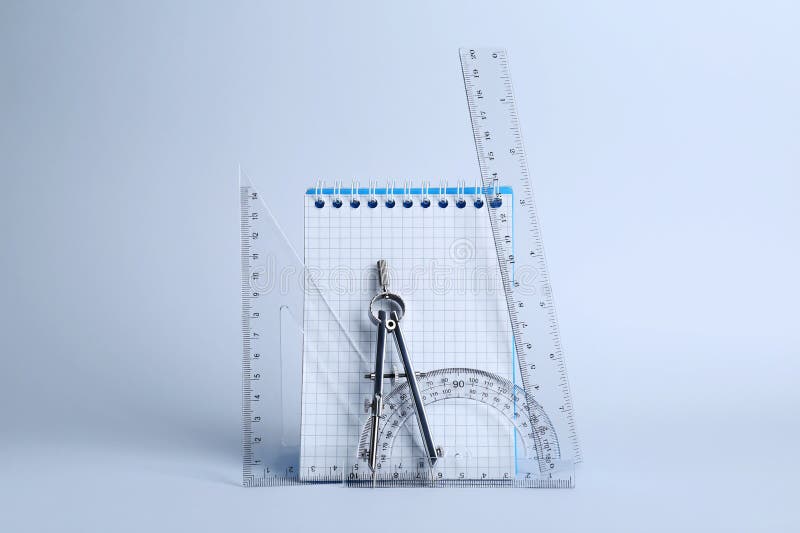 Triangle, Notebook, Protractor and Compass on White Background Stock ...