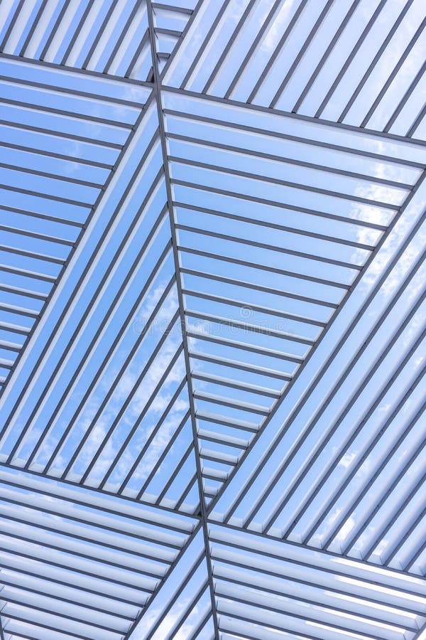 Triangle Pattern of a Building Metal Lines Against Blue Sky Background ...