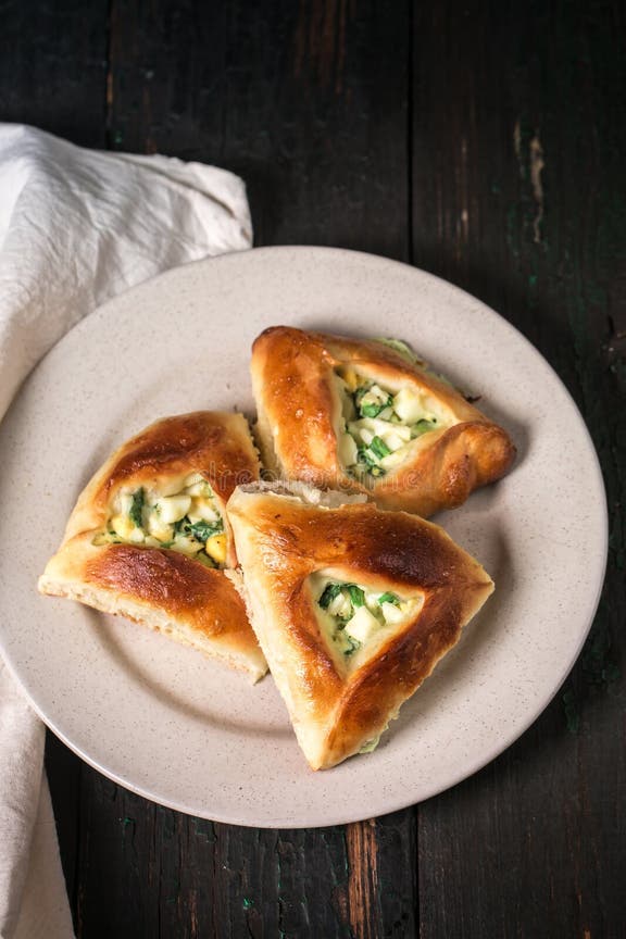 Triangle pie with onion stock photo. Image of cloth - 129658960