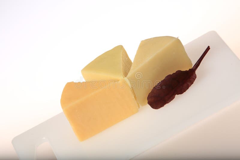 Triangle Pieces of Cheese Next To Each Other Stock Photo - Image of ...