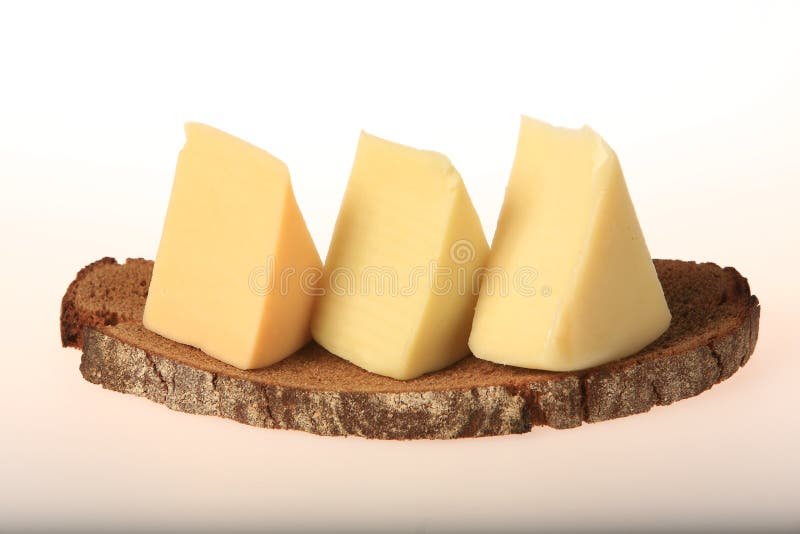 Triangle Pieces of Cheese Next To Each Other Stock Image - Image of ...