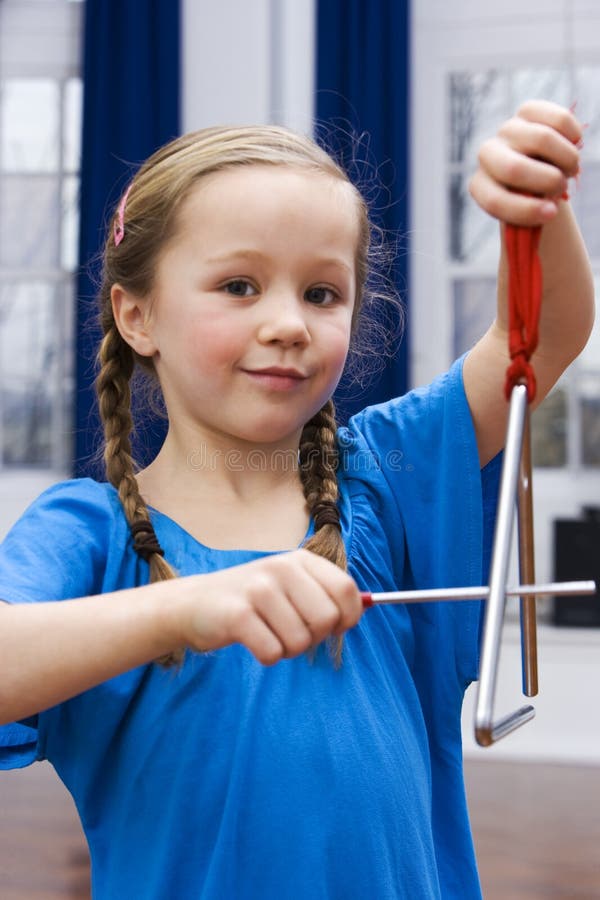 Triangle player stock photo. Image of triangle, blond - 10676726