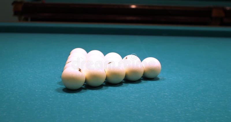 A Green Billiard Table with Balls Lying on it without People. a ...