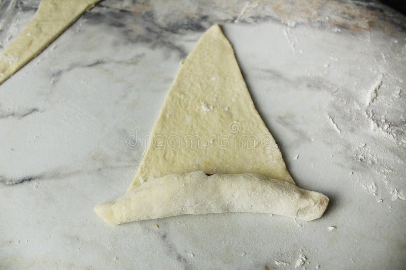A Triangle of Raw Puff Pastry is Wrapped in a Croissant. Making ...