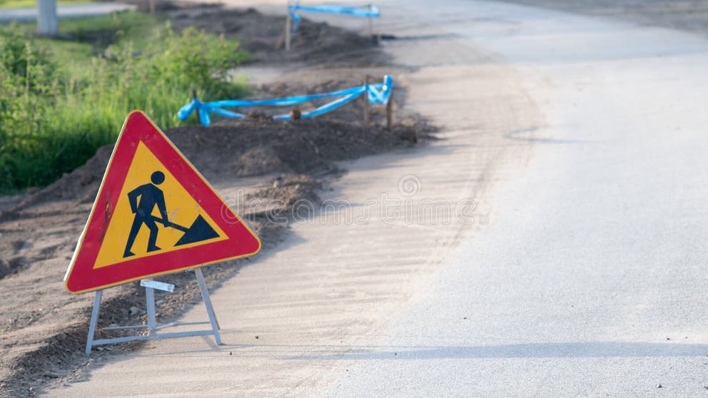 Triangle Road Sign Work in Progress on a Street Under Reconstruction ...