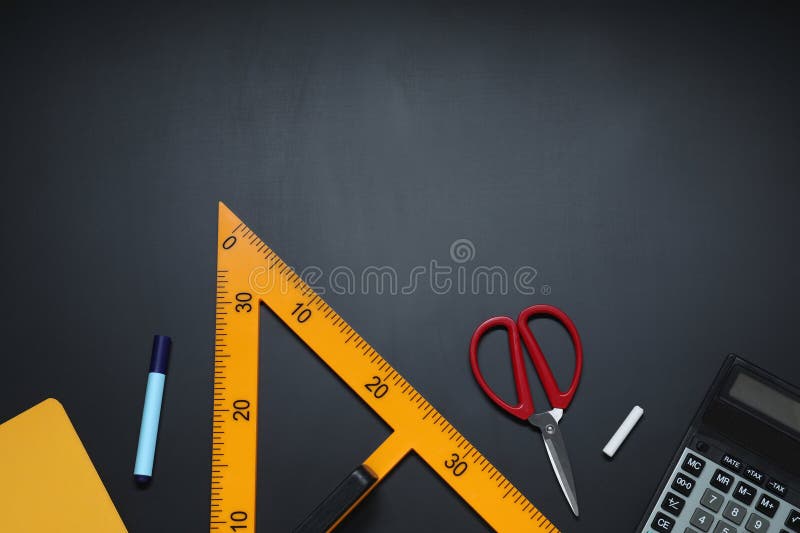 Triangle Ruler, Scissors, Chalk, Calculator, Marker and Notebook on ...