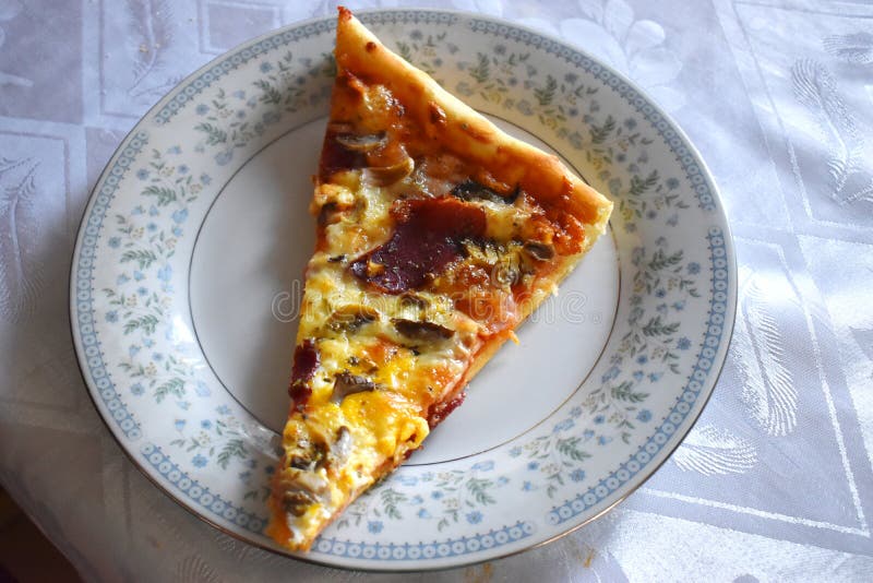 A Triangle Shape Slice of Homemade Pizza Stock Photo - Image of cheese ...