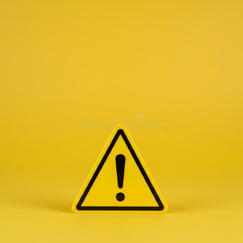 Triangle-shaped Warning Sign with a Black Exclamation Mark in the ...