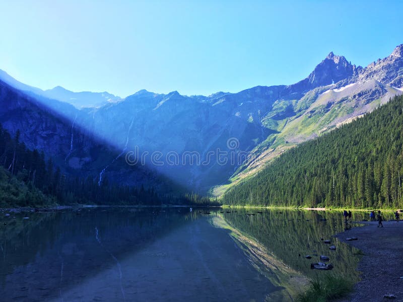 Triangle Sun Rays on Avalanche Lake Stock Photo - Image of lake ...