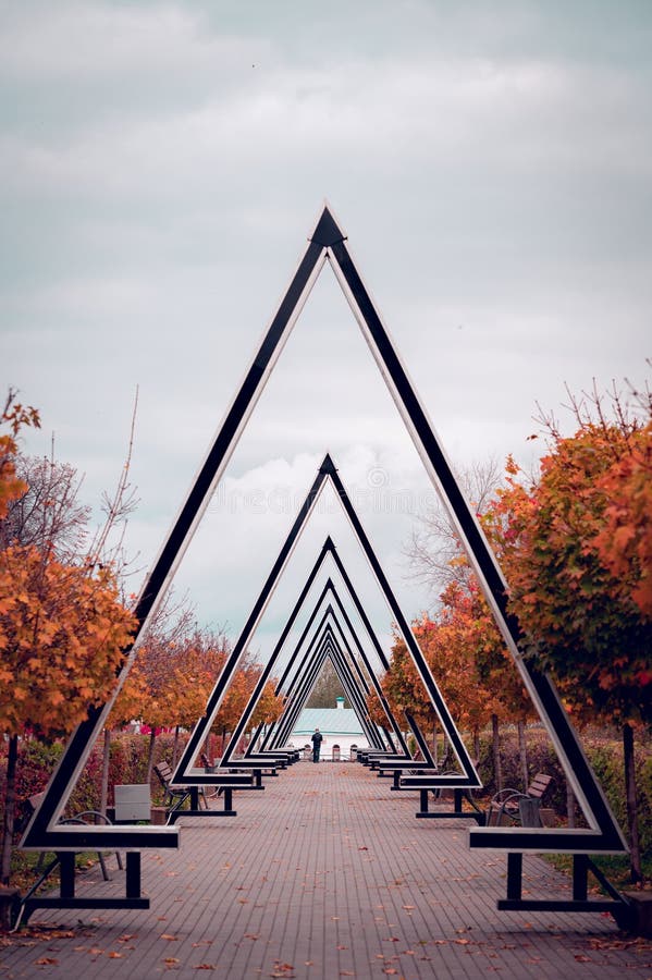 Triangular Arches and an Alley of Golden Maple Trees. Stock Image ...