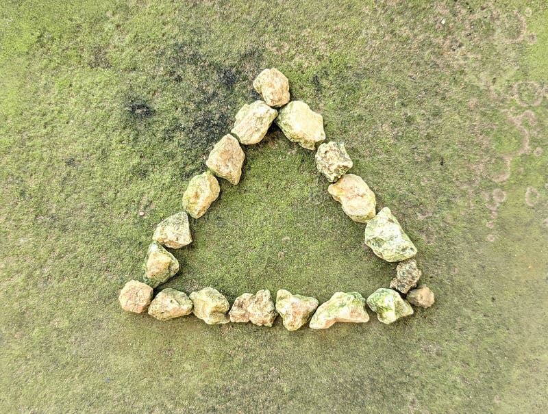 A Triangular Arrangement of Karst Stones with a Mossy Background Stock ...