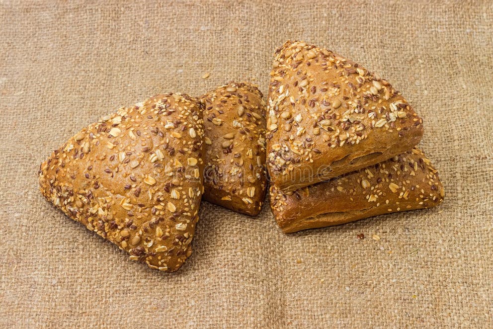 Triangular Breads Sprinkled with Different Seeds on a Sackcloth Stock ...