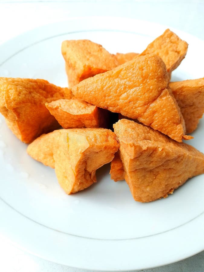 Triangular Brown Tofu is Arranged on a White Plate Stock Photo - Image ...