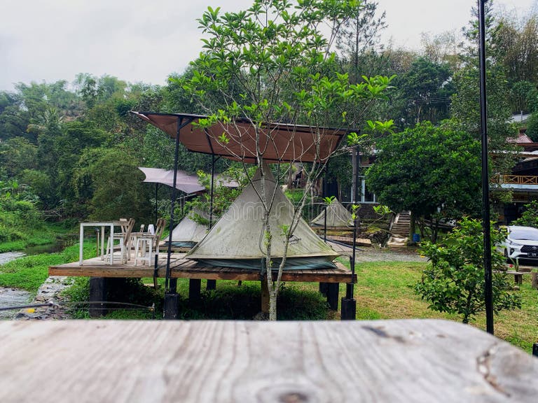 Triangular Camping Tent in the Middle of Stock Image - Image of tables ...