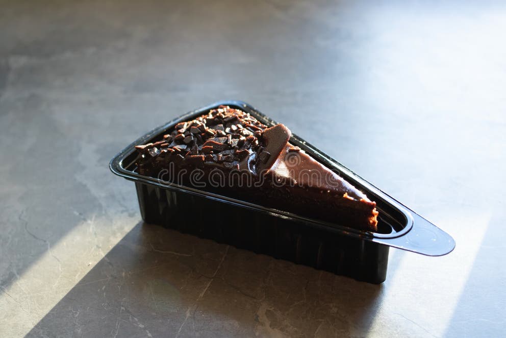 Triangular Chocolate Cake on the Table Closeup Stock Image - Image of ...