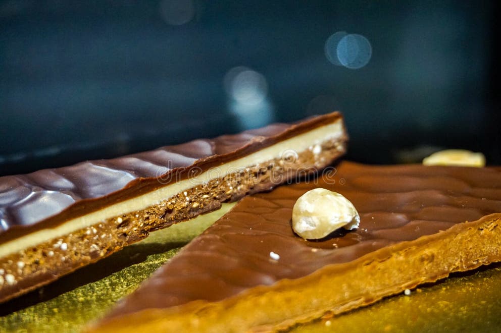 Triangular chocolate piece stock photo. Image of sugar - 154872738