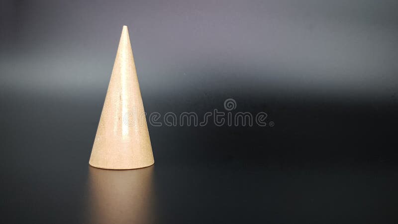The Triangular Cone is Made of Wood on a Black Background. Various ...