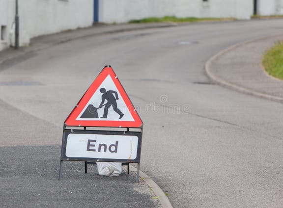 Triangular Construction Sign Standing on Footpath Stock Image - Image ...